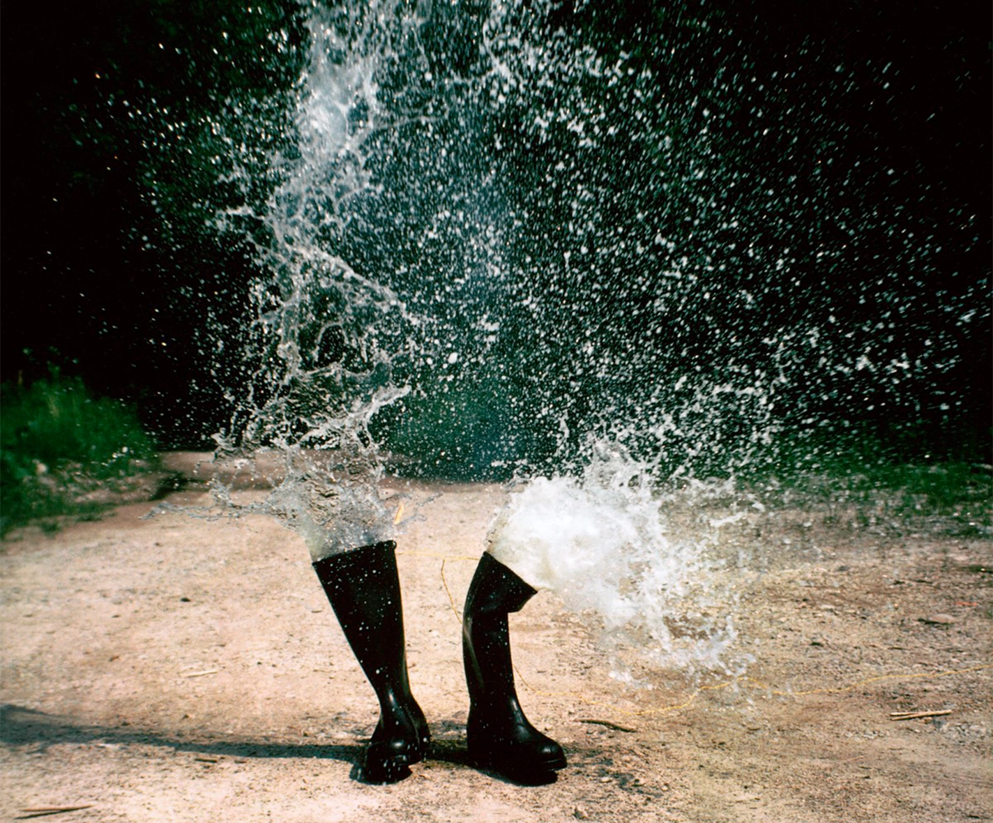A dramatic installation by Roman Signer captured mid-action, showing a ...